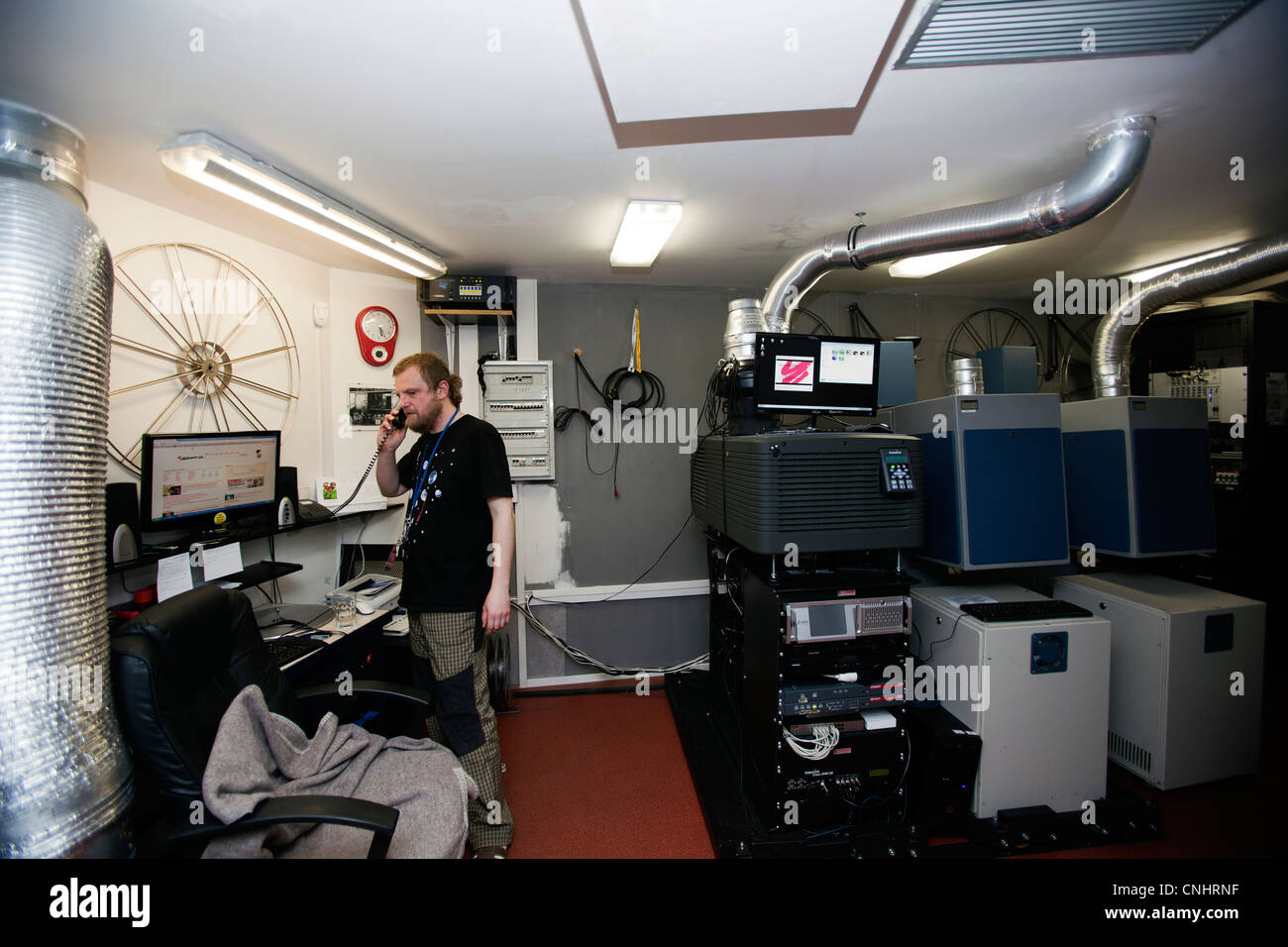 A projectionist projecting room Cinema Atlas in Prague during ...