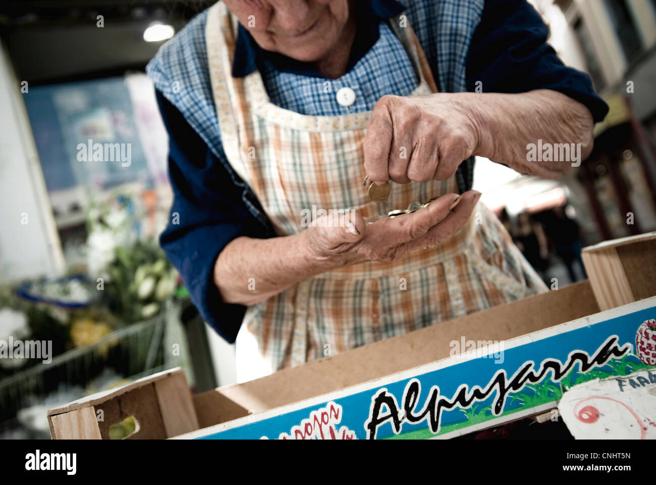 Old lady selling fruits on the street of Granada Stock Photo - Alamy