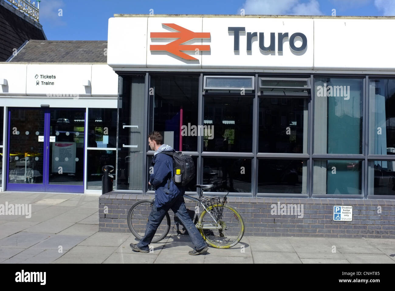 A man with his bike at Truro station Stock Photo - Alamy