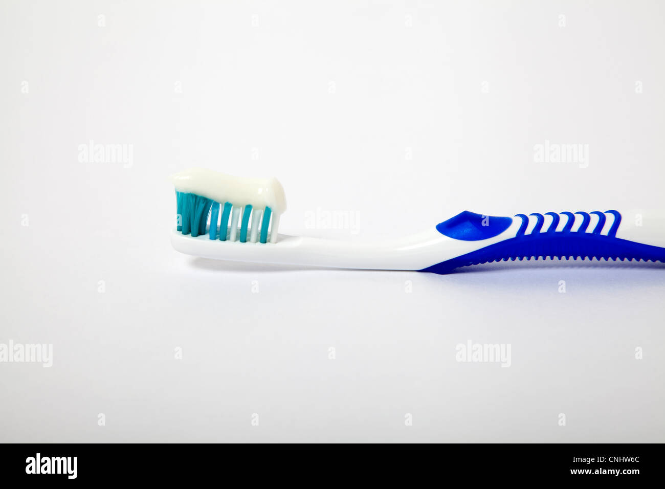 Toothbrush with white toothpaste Stock Photo - Alamy