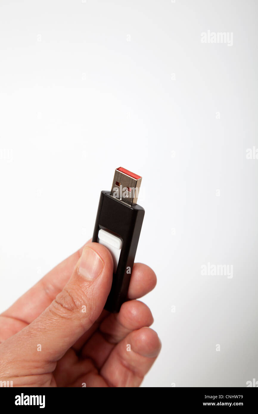 Man holding usb drive stick Stock Photo - Alamy