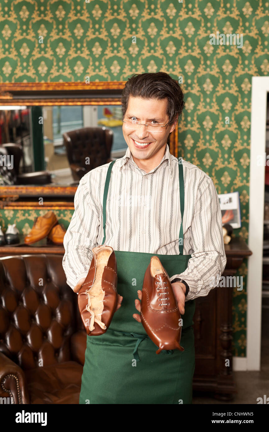 Shoemaker sits hi-res stock photography and images - Alamy