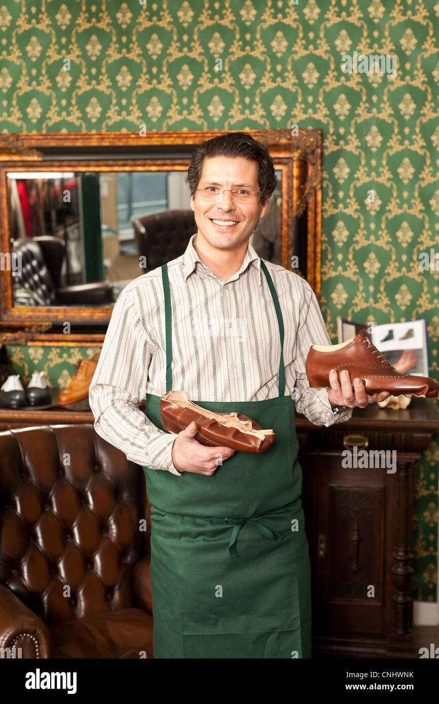 Shoemaker sits hi-res stock photography and images - Alamy