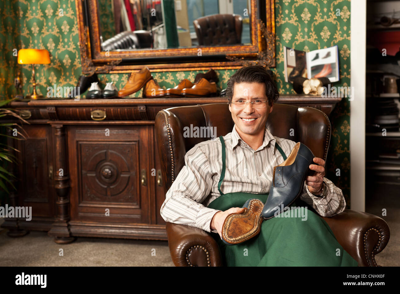 Shoemaker sits hi-res stock photography and images - Alamy