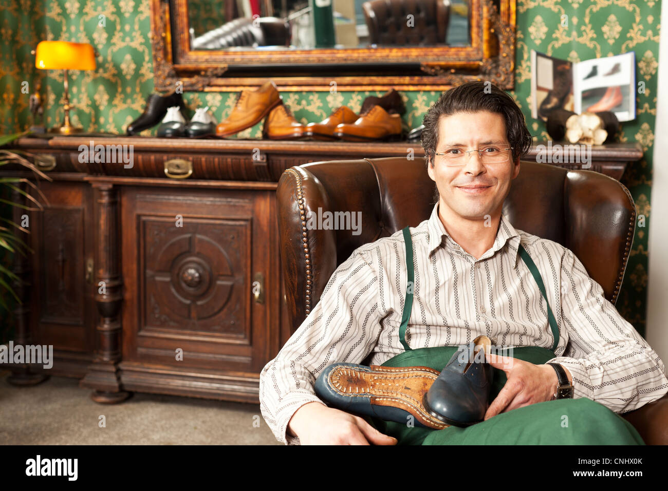 Shoemaker sits hi-res stock photography and images - Alamy