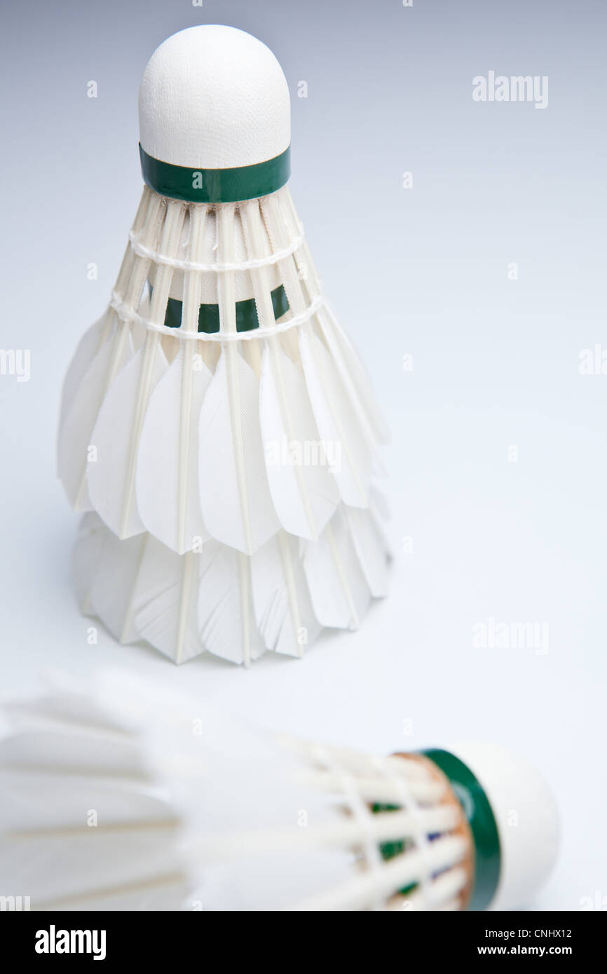 Badminton shuttlecocks on white (color toned image Stock Photo - Alamy