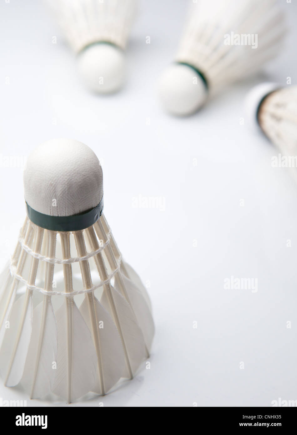 Badminton shuttlecocks on white (color toned image Stock Photo - Alamy
