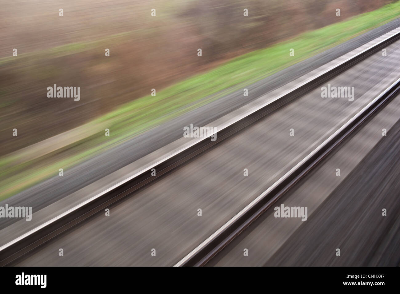 Railroad seen from a fast moving train. (motion blurred image; color ...