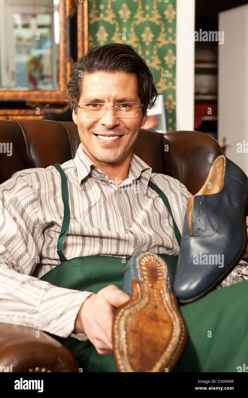 Shoemaker sits hi-res stock photography and images - Alamy