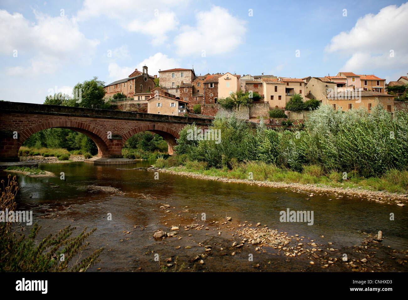 Stone bridge leading to a small town Stock Photo - Alamy