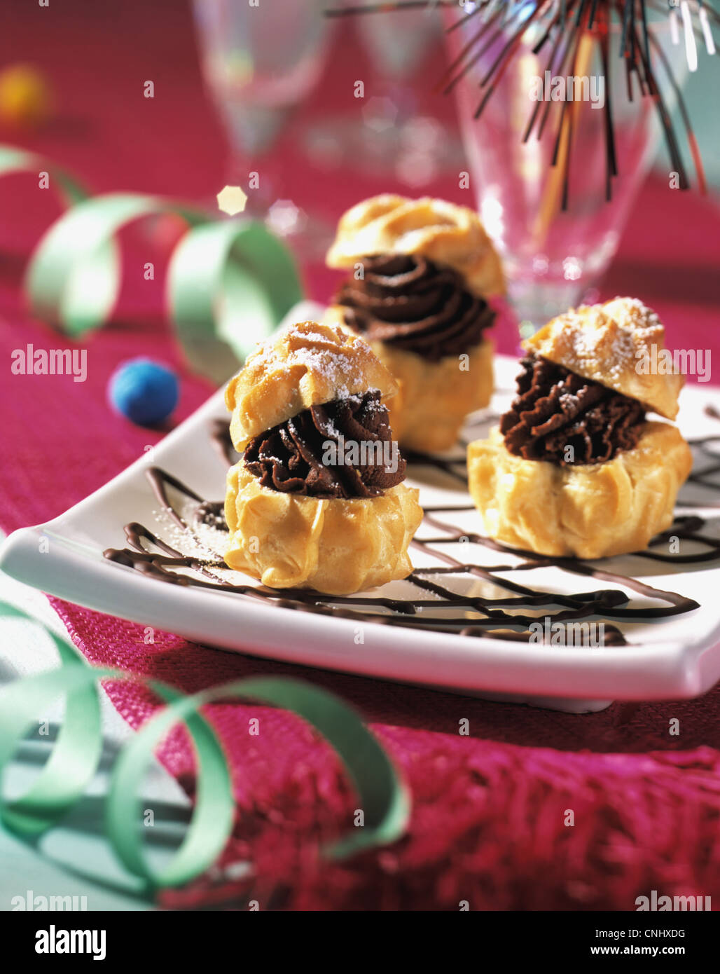 Small puff pastry balls with chocolate mousse Stock Photo - Alamy