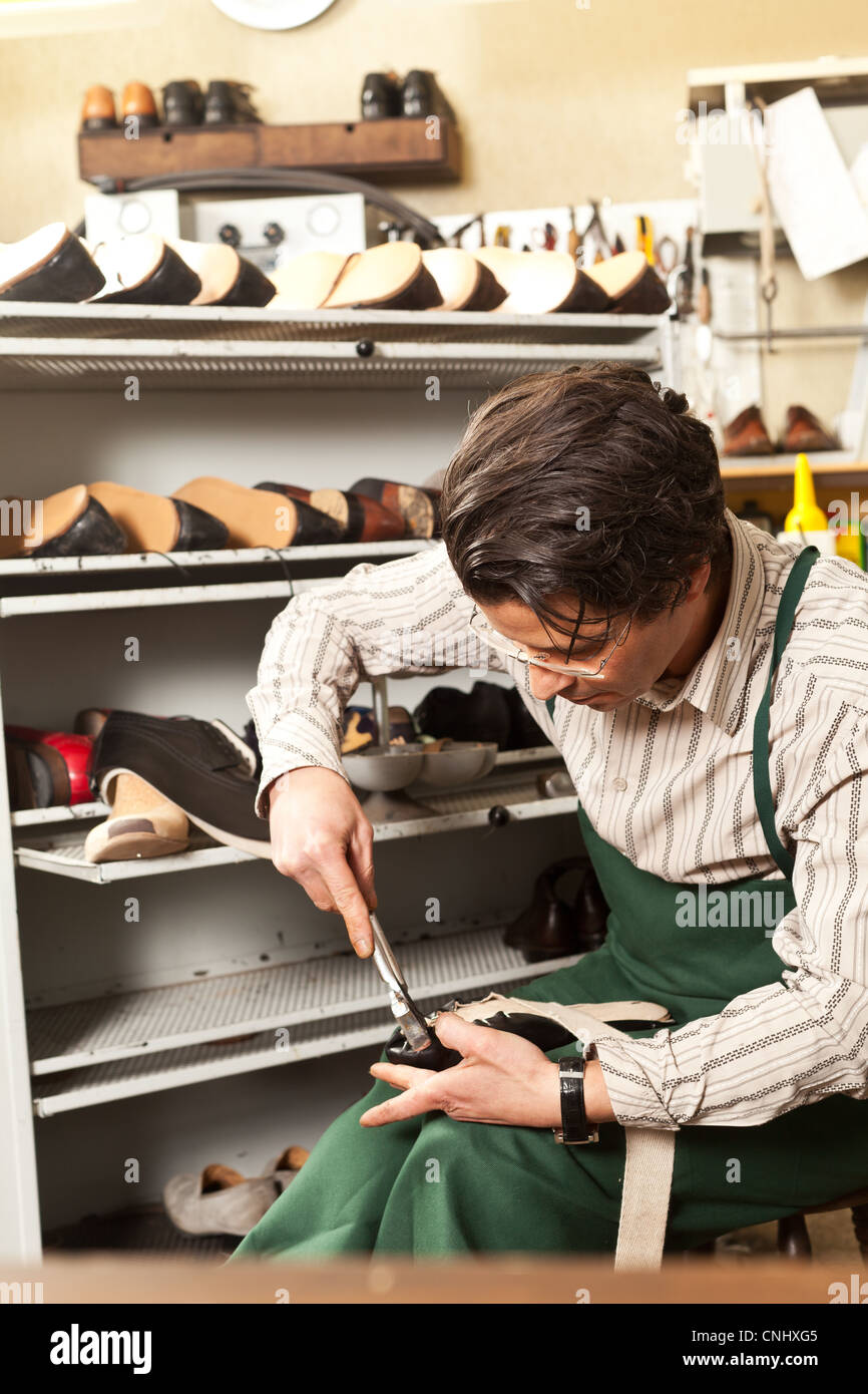 Shoemaker sits hi-res stock photography and images - Alamy