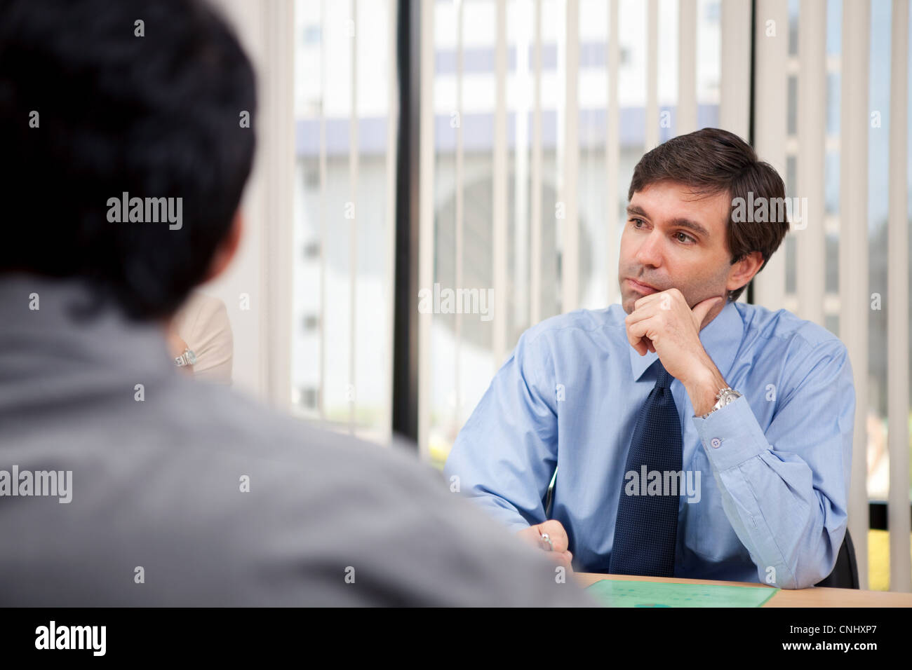 Business executive listening in a meeting Stock Photo - Alamy