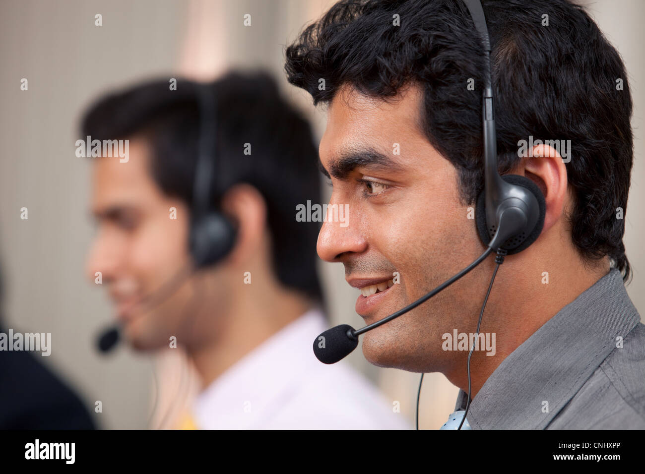 Call center agent smiling Stock Photo - Alamy