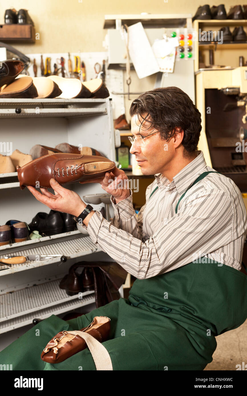 Shoemaker sits hi-res stock photography and images - Alamy