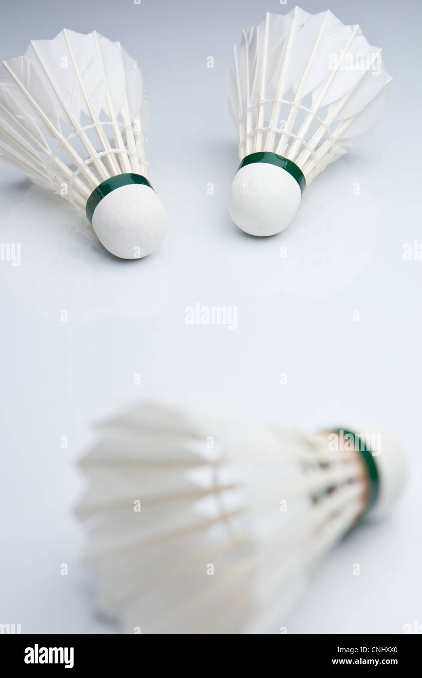 Badminton shuttlecocks on white (color toned image Stock Photo - Alamy