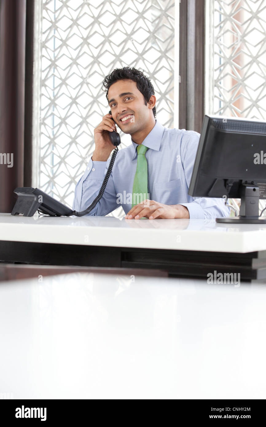 Executive talking on a phone Stock Photo - Alamy