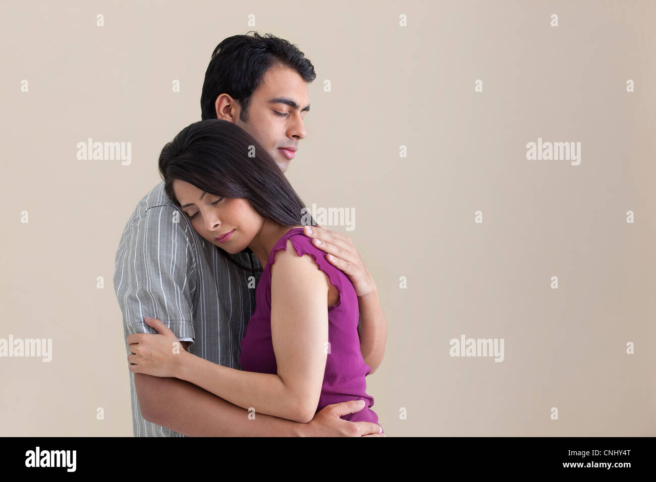 Married couple hugging Stock Photo - Alamy