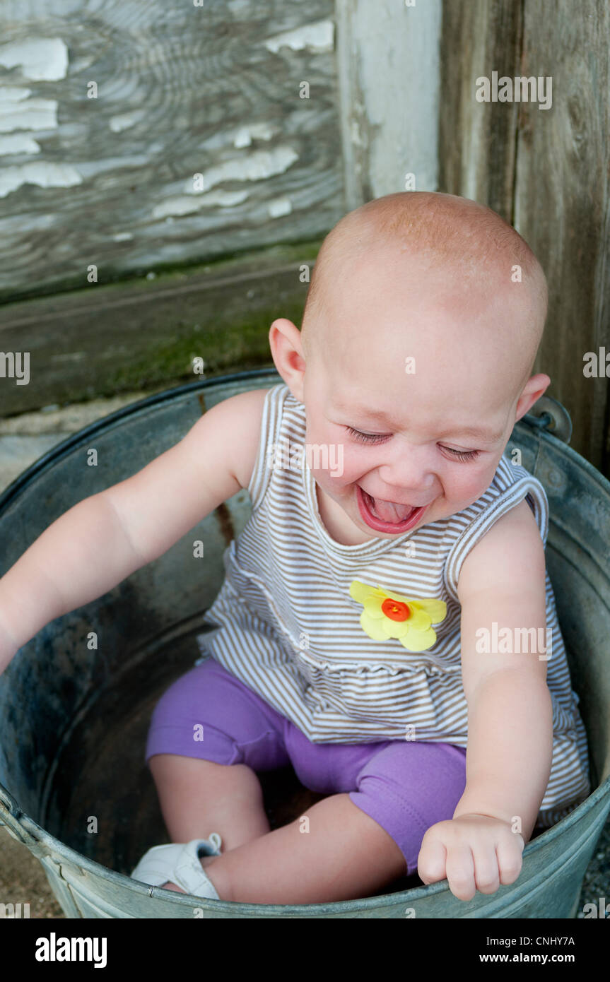Baby in a bucket hi-res stock photography and images - Alamy