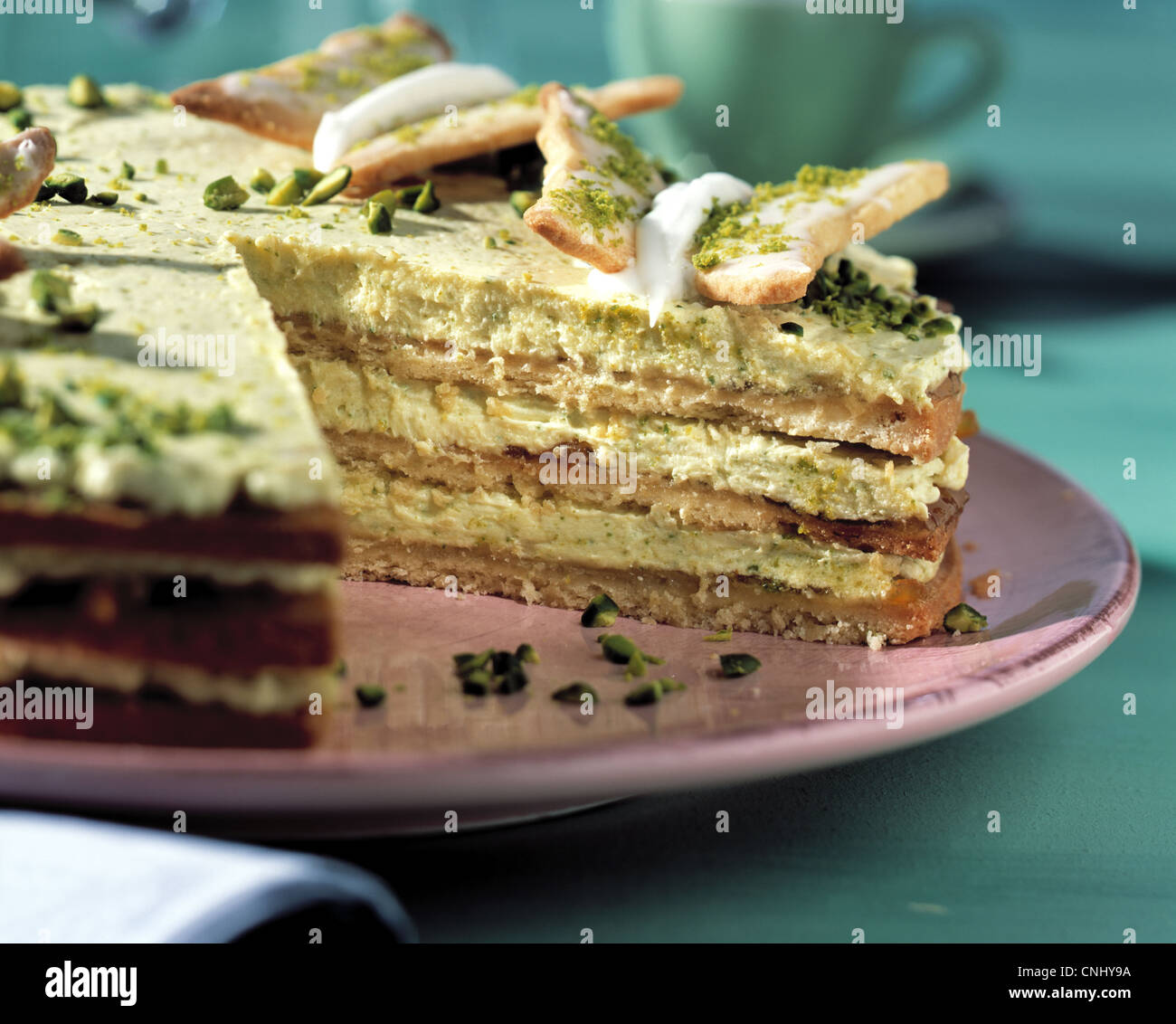 Layered mignon cake with butterflies Stock Photo - Alamy