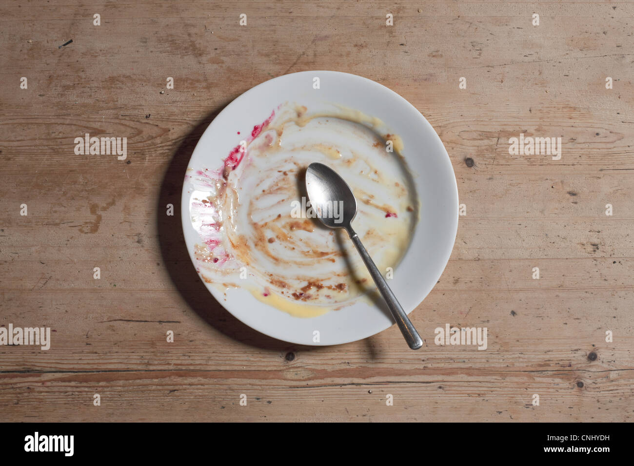 Remains of eaten pudding on plate Stock Photo - Alamy