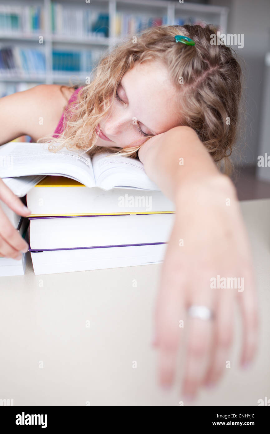 pretty female tired/exhausted/sleepy college student taking a nap in a ...