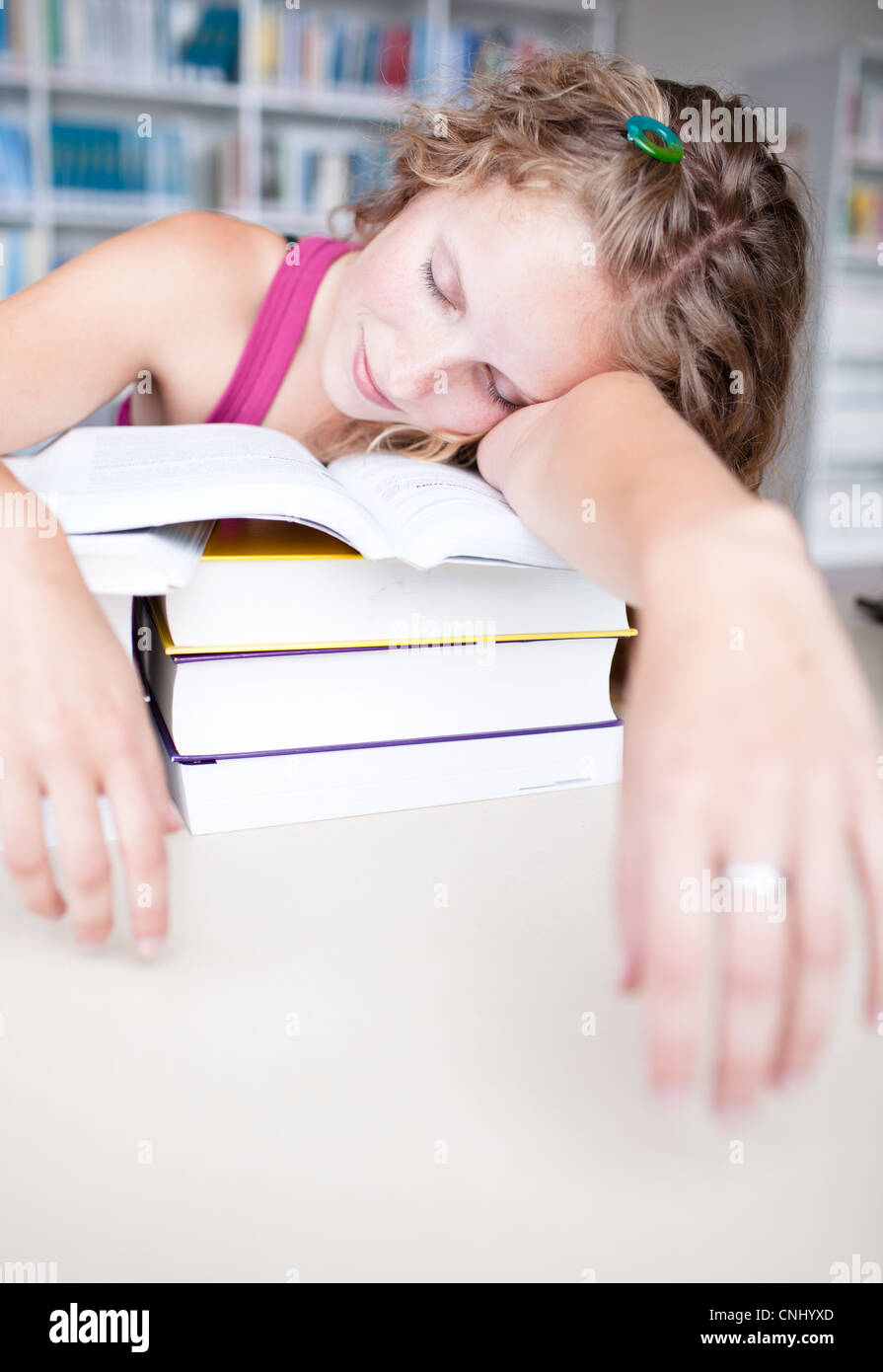 pretty female tired/exhausted/sleepy college student taking a nap in a ...