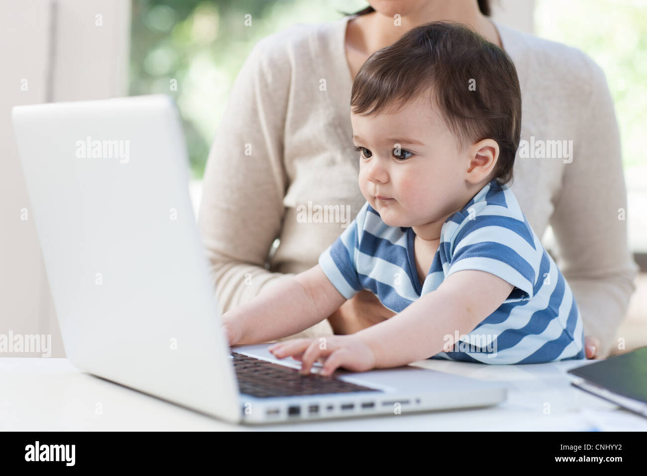 Baby boy using laptop Stock Photo - Alamy