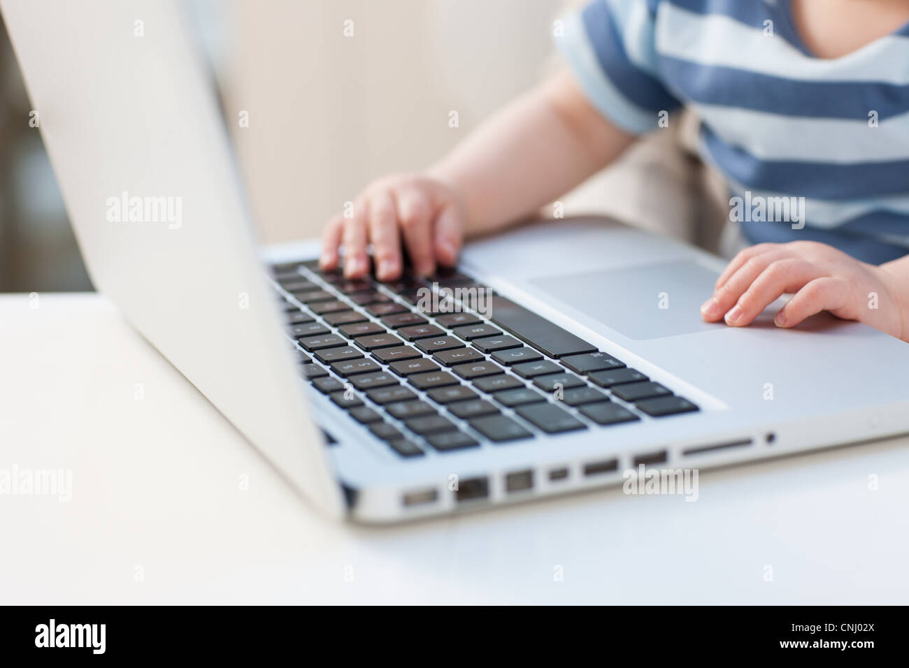 Baby using a laptop Stock Photo - Alamy