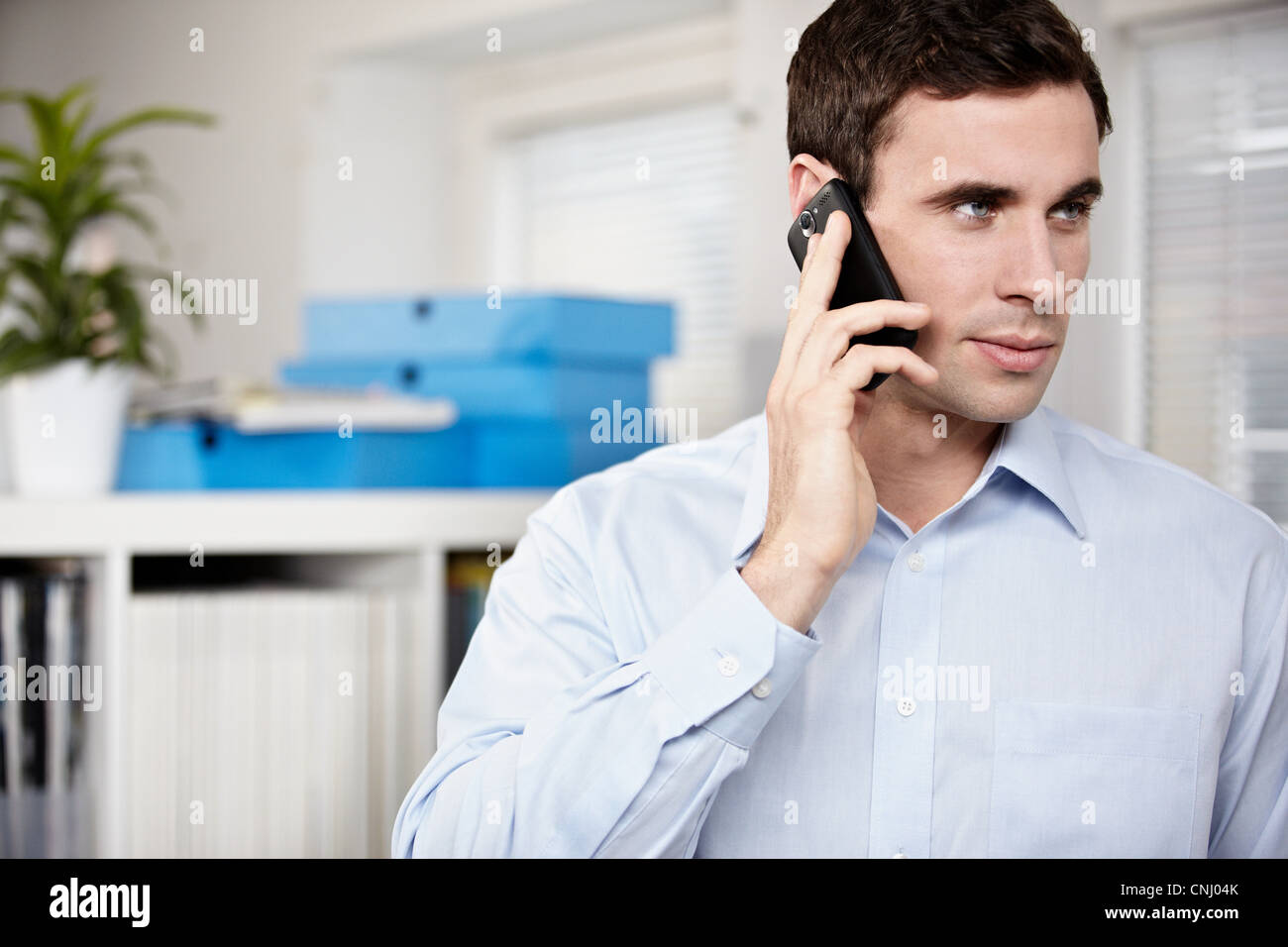 Office worker on cellphone Stock Photo - Alamy