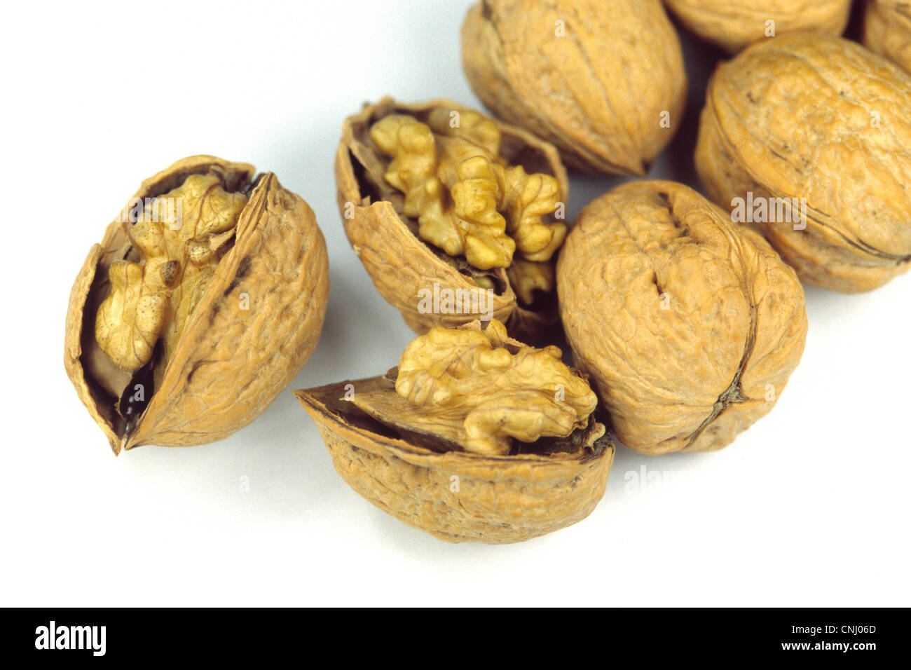 Cracking Walnuts Over White Background Stock Photo - Alamy