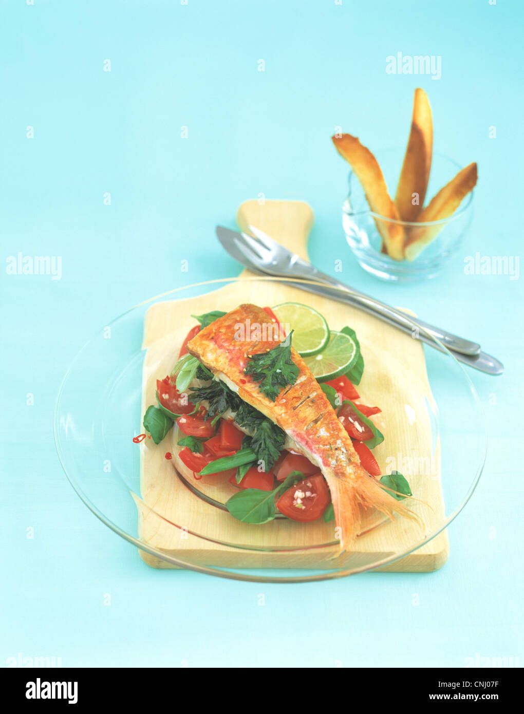 Red barbel with tomato salsa Stock Photo - Alamy