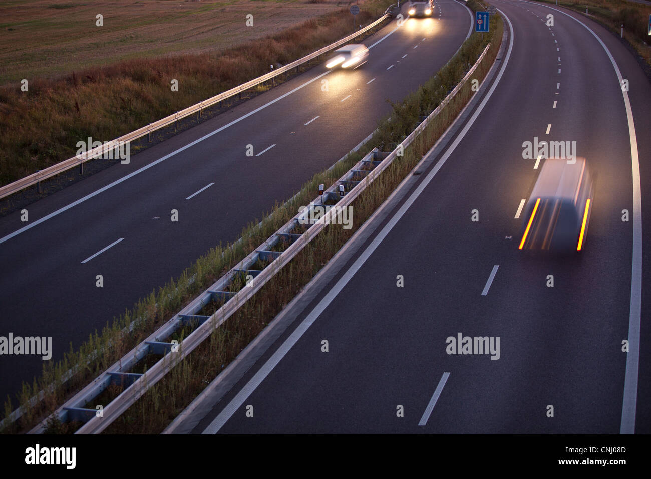 highway traffic - motion blurred truck on a highway/motorway/speedway ...