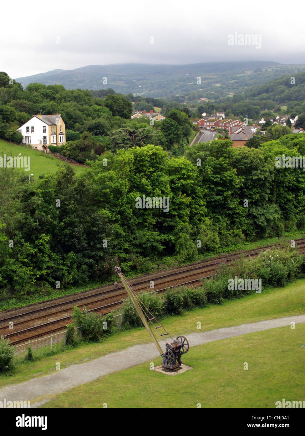 Misty hillside with train lines in foreground taken from Conway castle ...