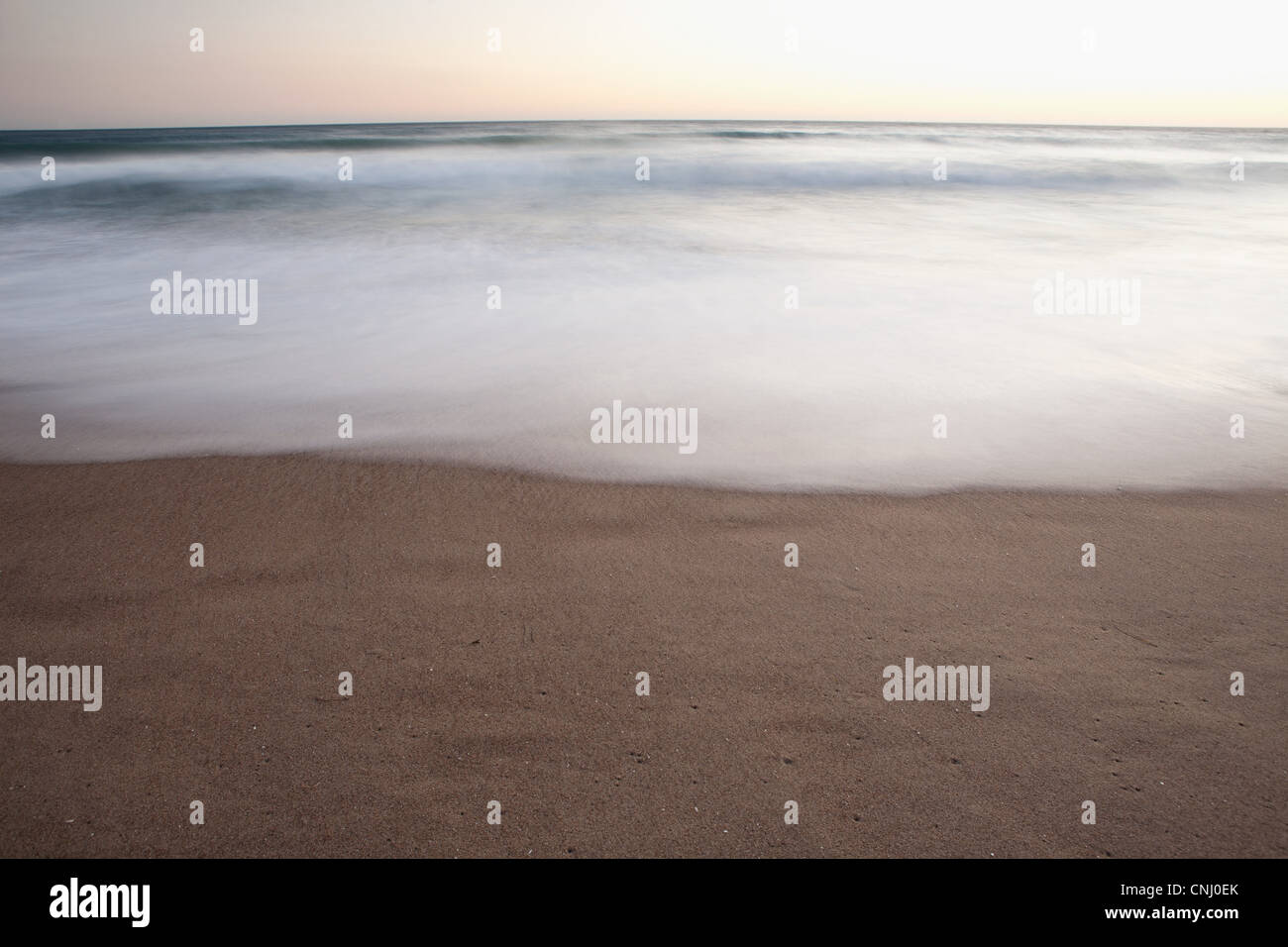 Long exposure of surf hitting the beach on the California coast Stock ...
