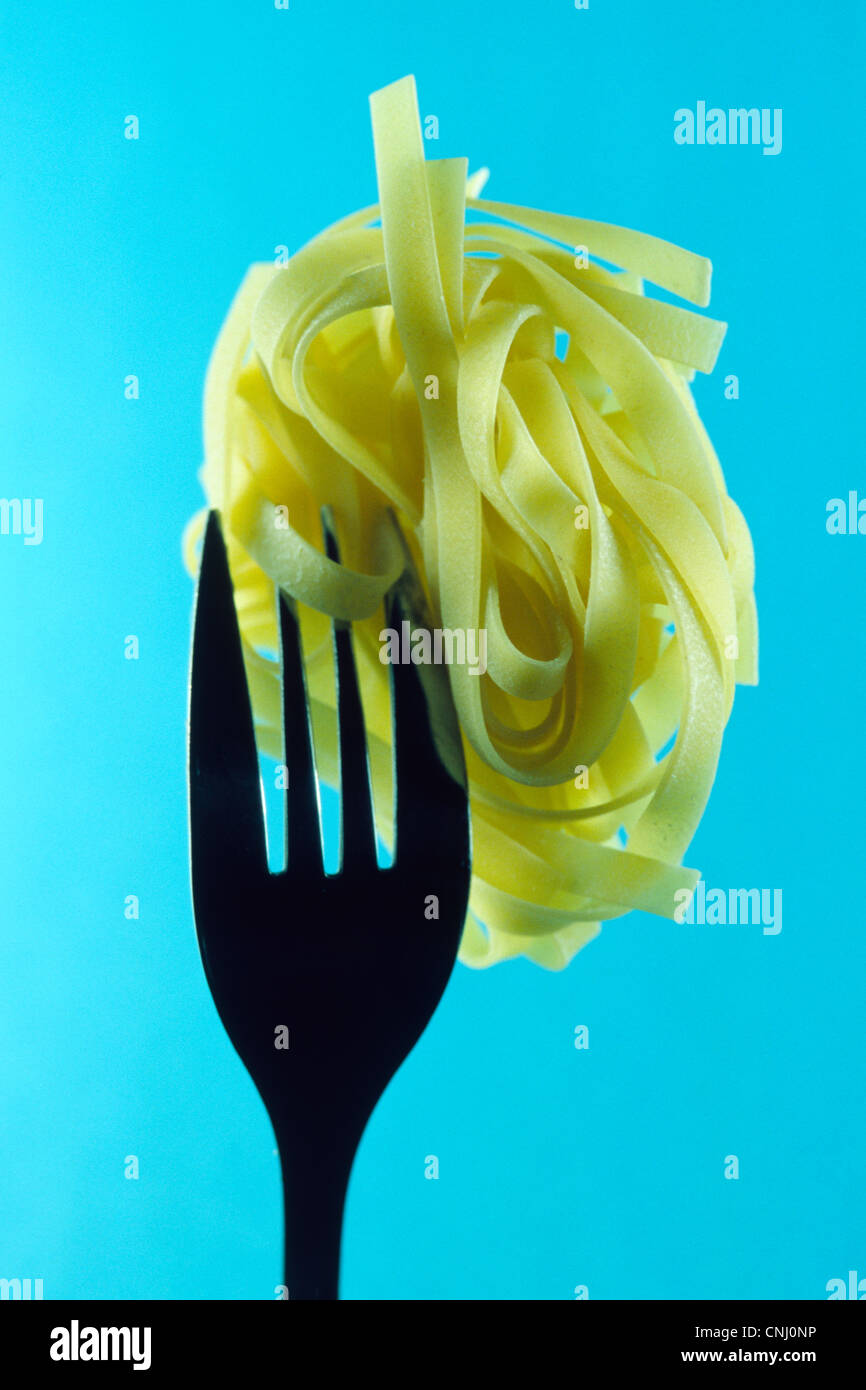 Fettuccine Fresh Pasta and Fork Stock Photo - Alamy