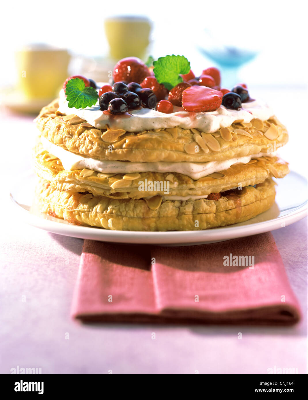 Puff pastry - layered - cake with different berries Stock Photo - Alamy