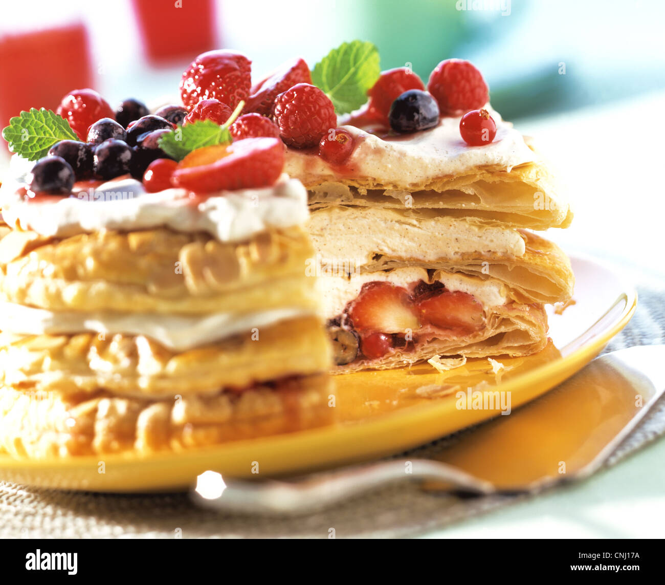 Puff pastry - layered - cake with different berries Stock Photo - Alamy