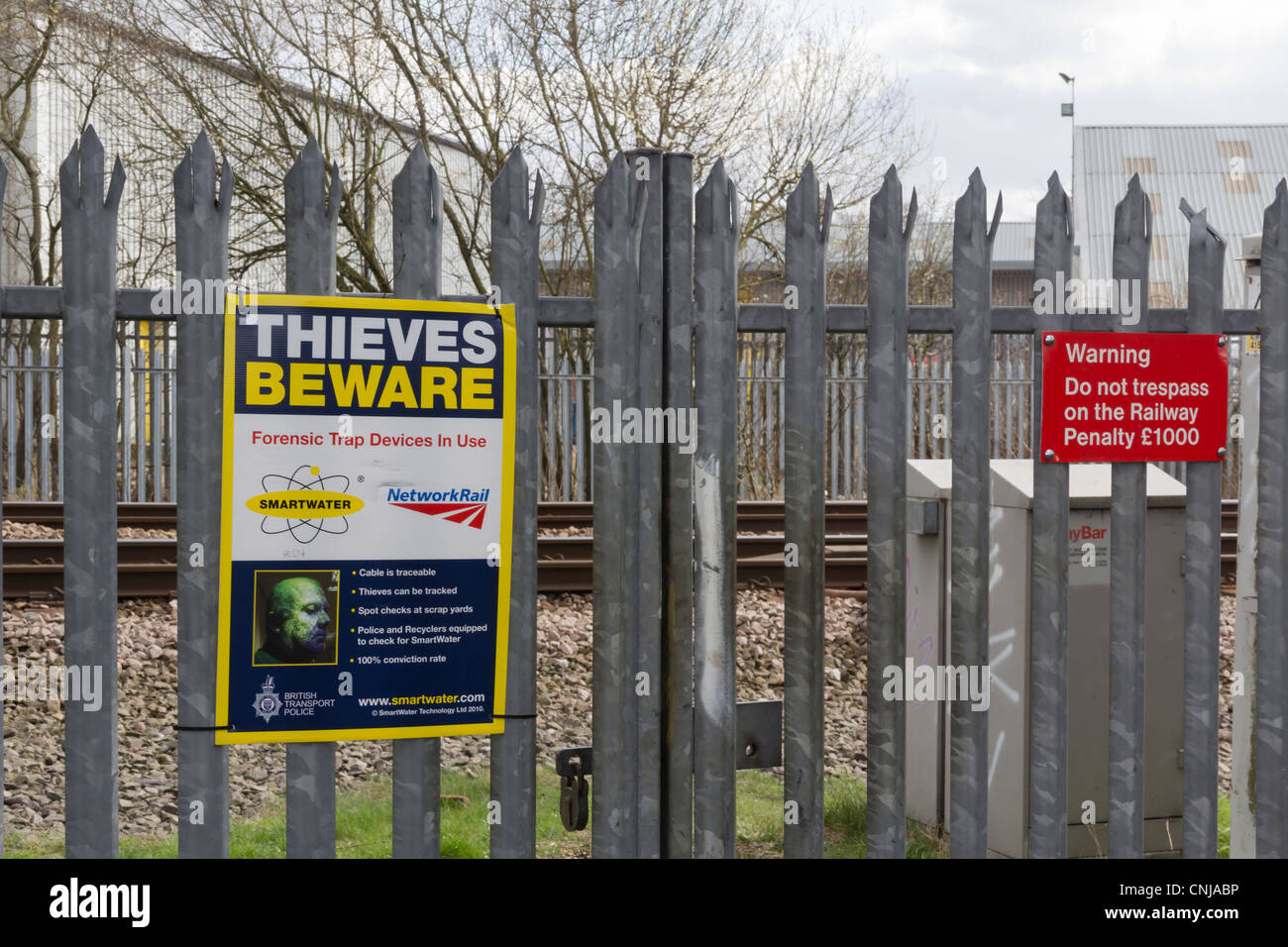 Smartwater in use warning signs near a railway signalling installation ...