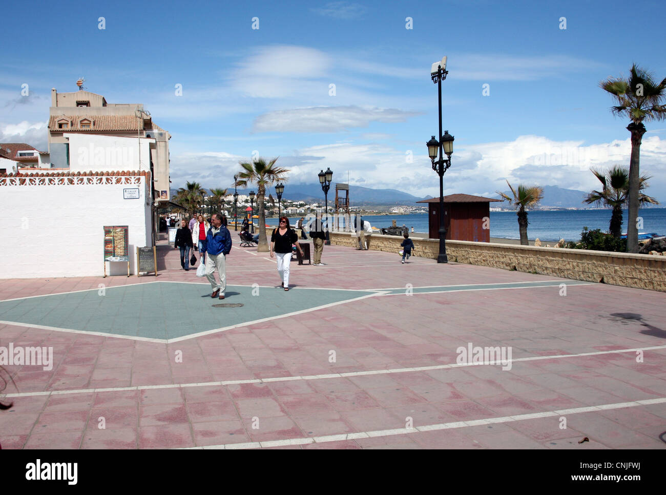 People walking along sunny promenade, Sabinillas, Andalucia, Southern ...