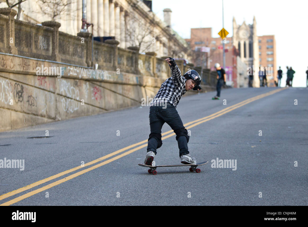 Young male skateboarder on urban street Stock Photo - Alamy