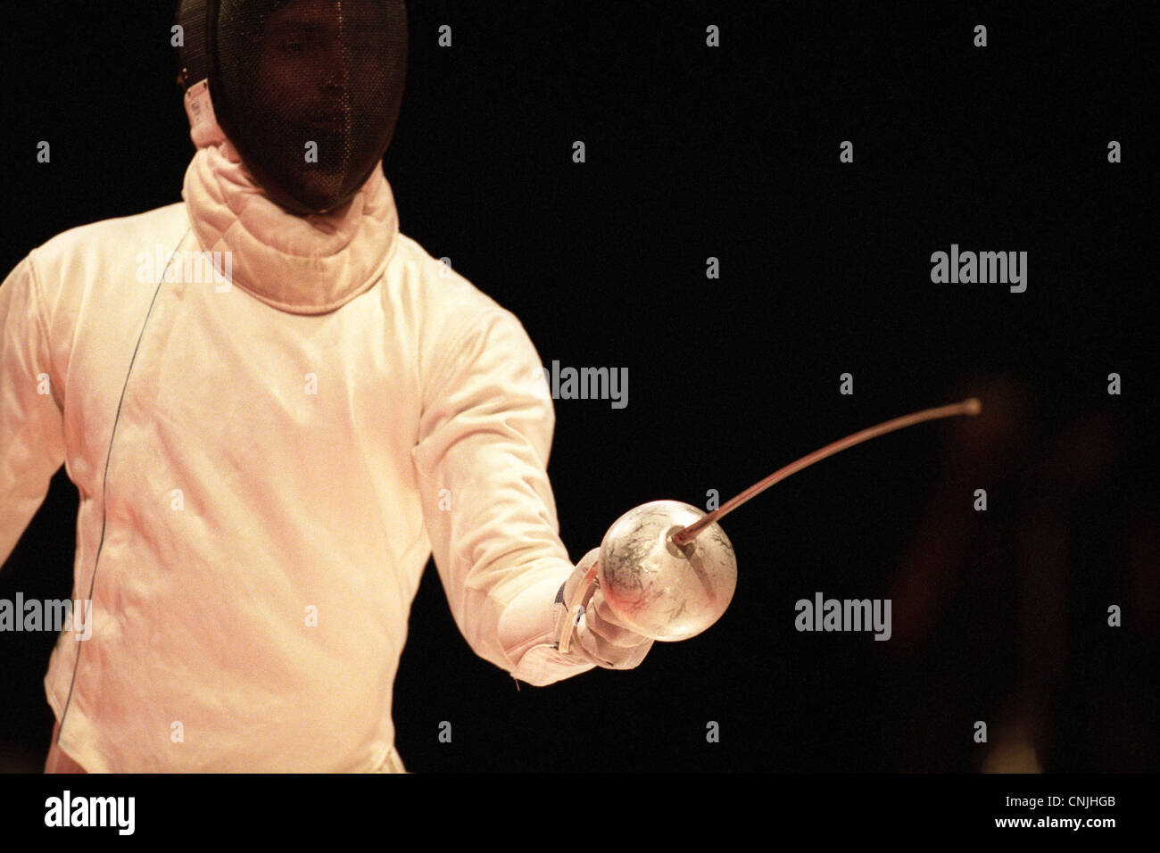 Male fencer in action Stock Photo - Alamy