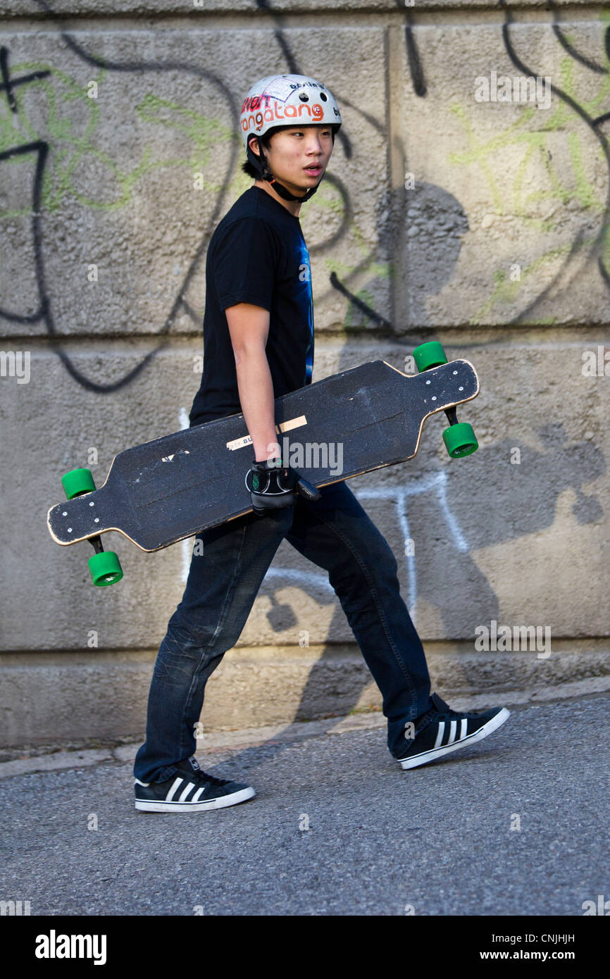 Young male skateboarder on urban street Stock Photo - Alamy