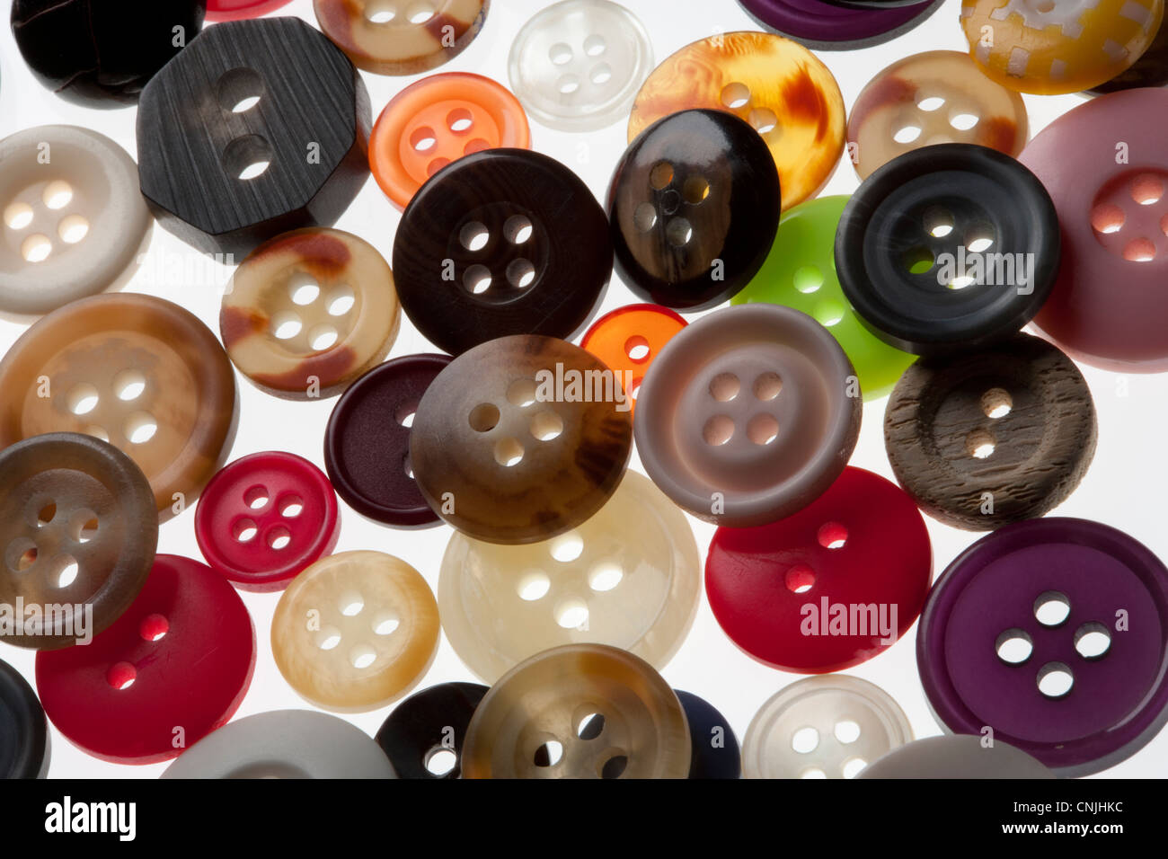 A range of different sized and coloured buttons Stock Photo - Alamy