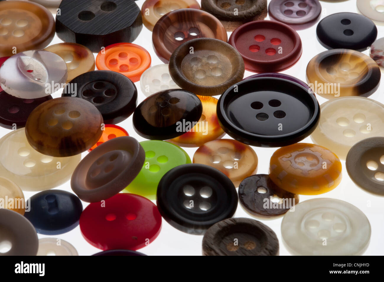 A range of different sized and coloured buttons Stock Photo - Alamy