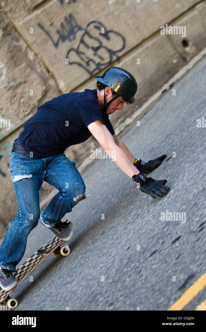 Young male skateboarder on urban street Stock Photo - Alamy