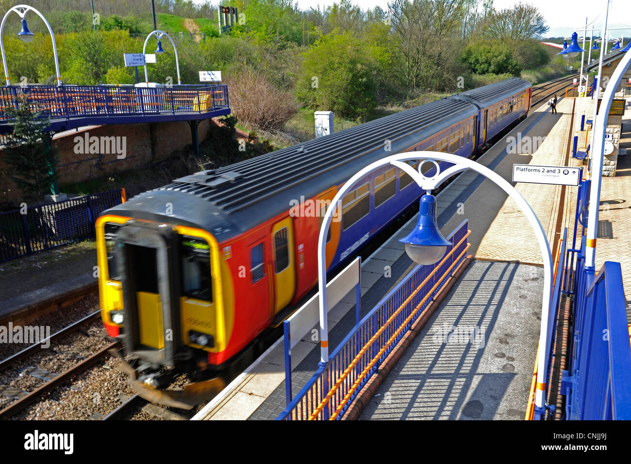 East midland commuter train pulling out of the local train station ...