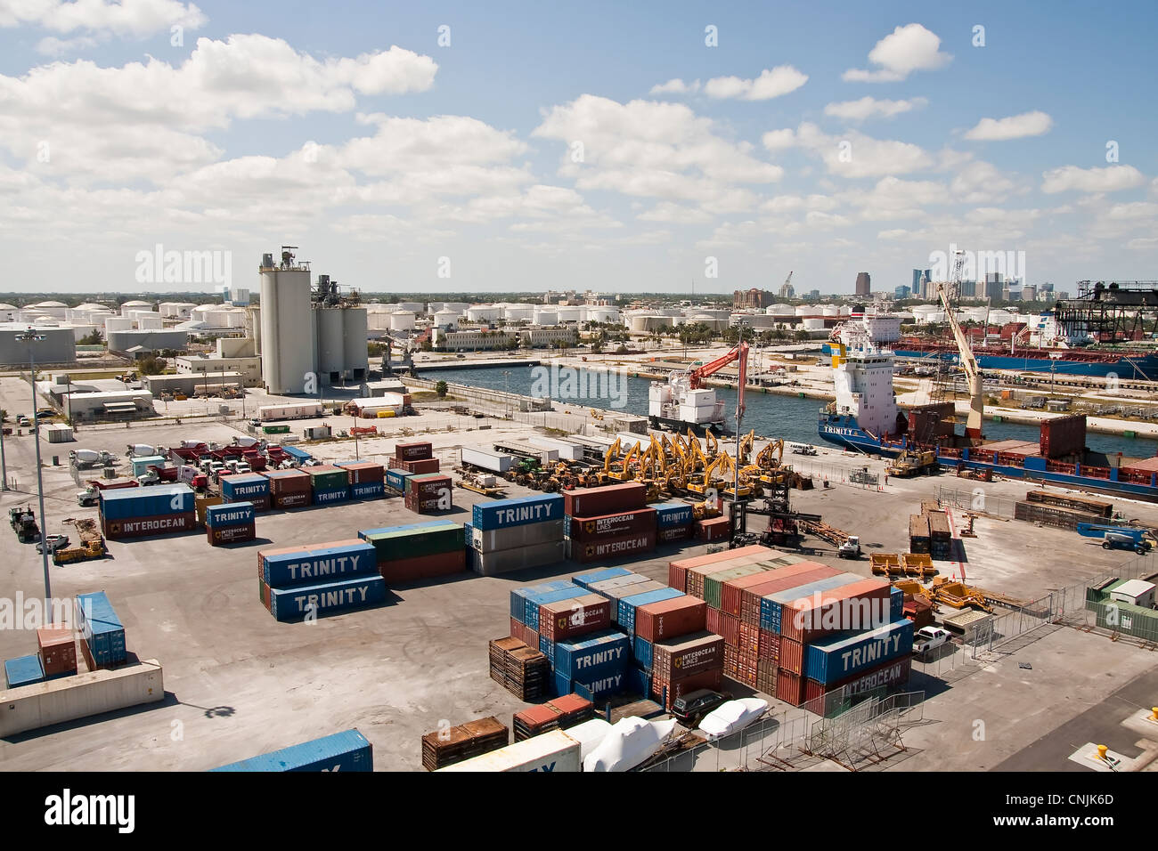 Freight Containers in a loading area by a harbor Stock Photo - Alamy