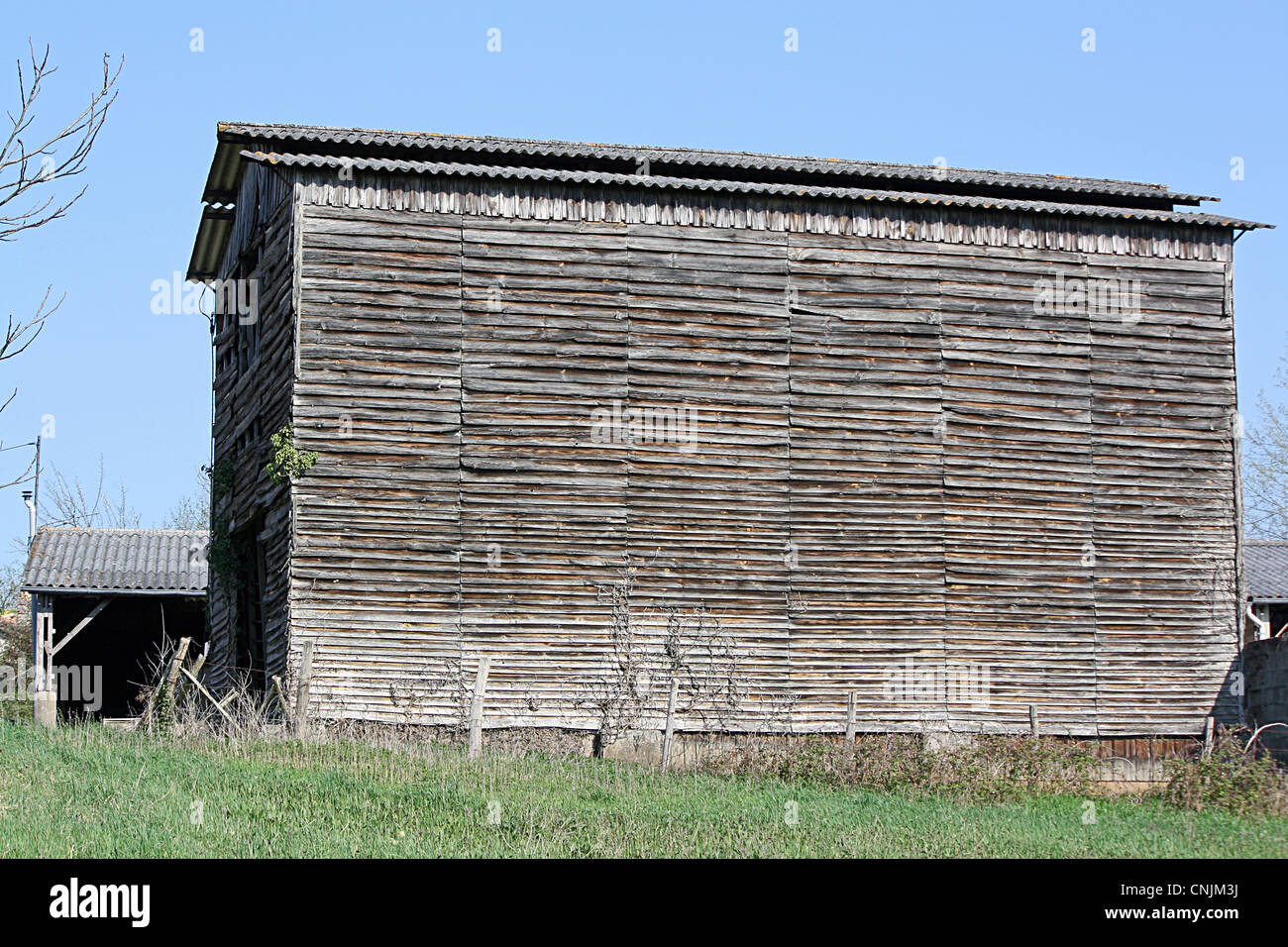Large wooden drying shed, Beaulieu, Dignac, France Stock Photo - Alamy