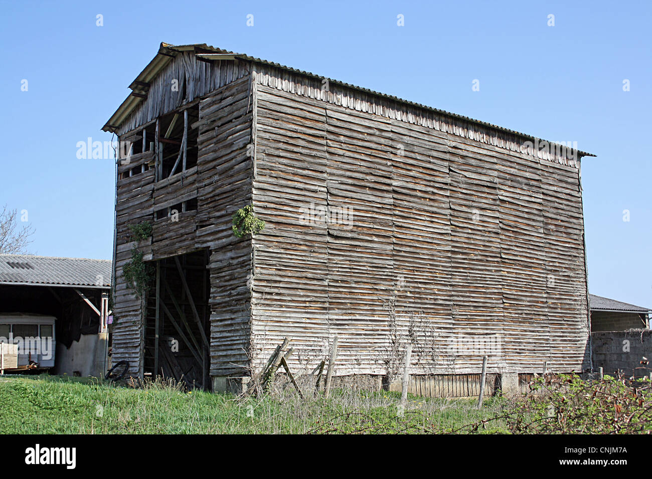 Large wooden drying shed, Beaulieu, Dignac, France Stock Photo - Alamy